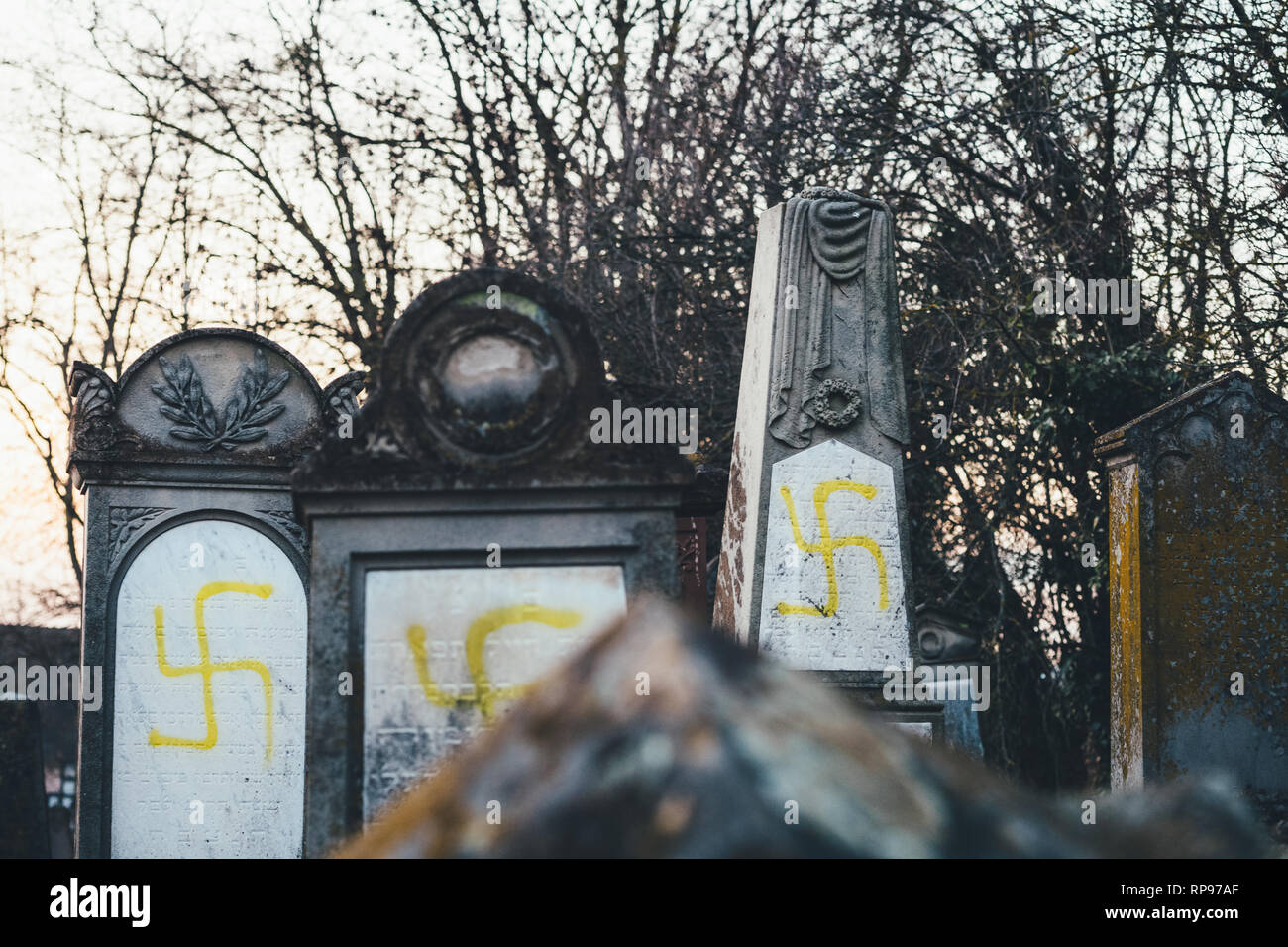 Vandalised graves with swastikas nazi symbols in yellow spray-painted ...