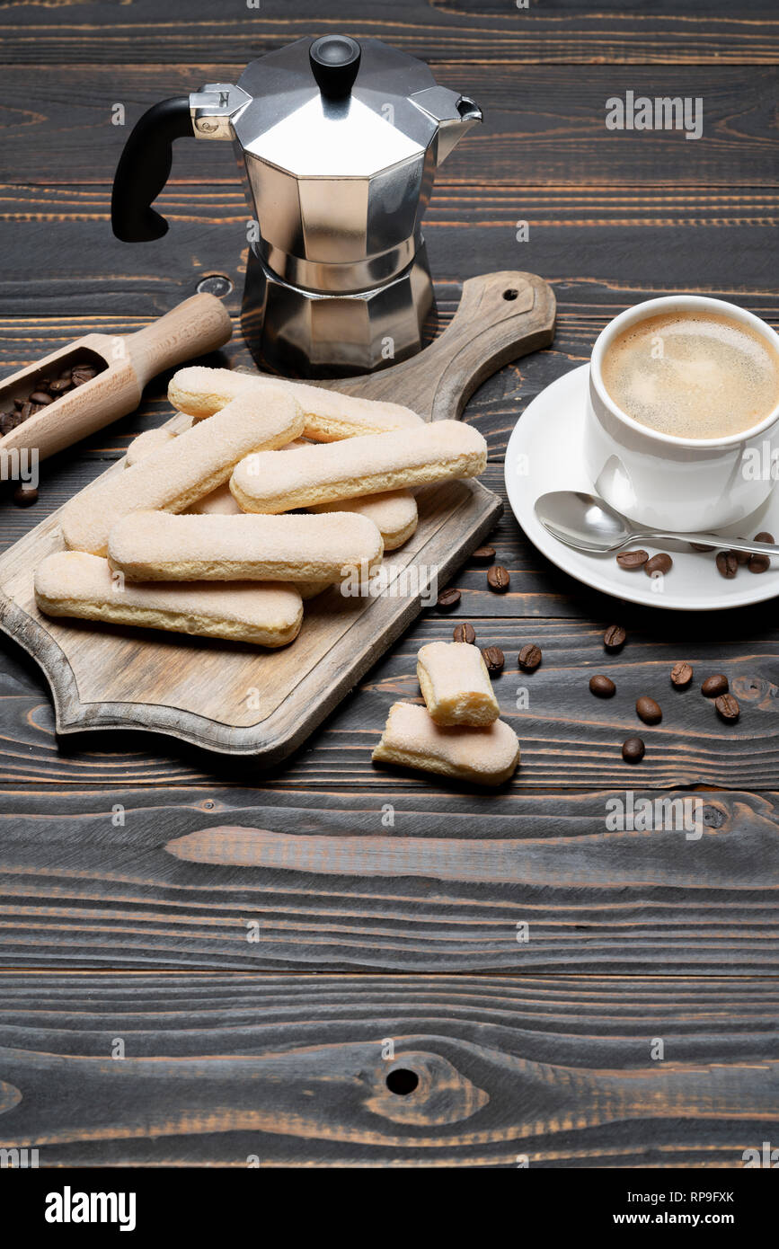 Italian Savoiardi ladyfingers Biscuits and cup of coffee on wooden ...