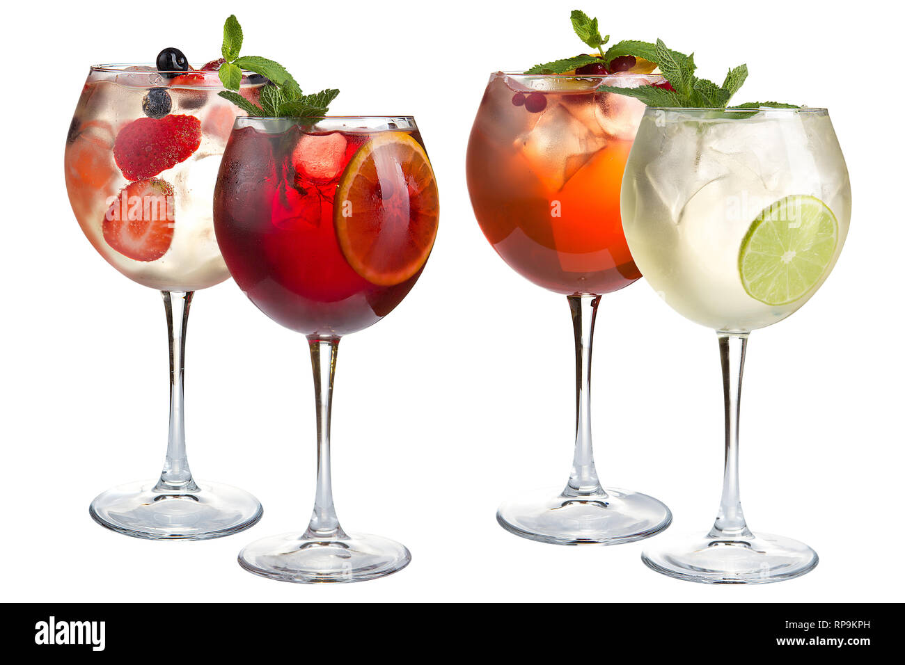 Alcohol cocktail with mint, fruits and berries on a white background. A ...