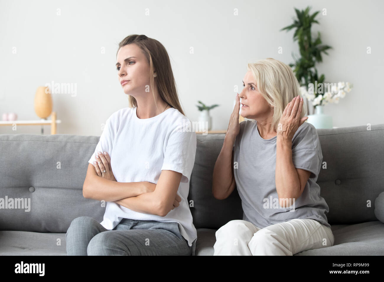 Angry aged mother quarreling, arguing with young daughter Stock Photo ...