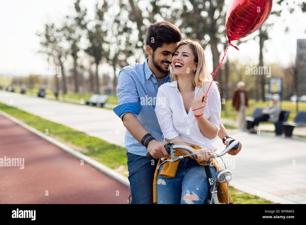 Romantic couple with bicycle hi-res stock photography and images - Alamy