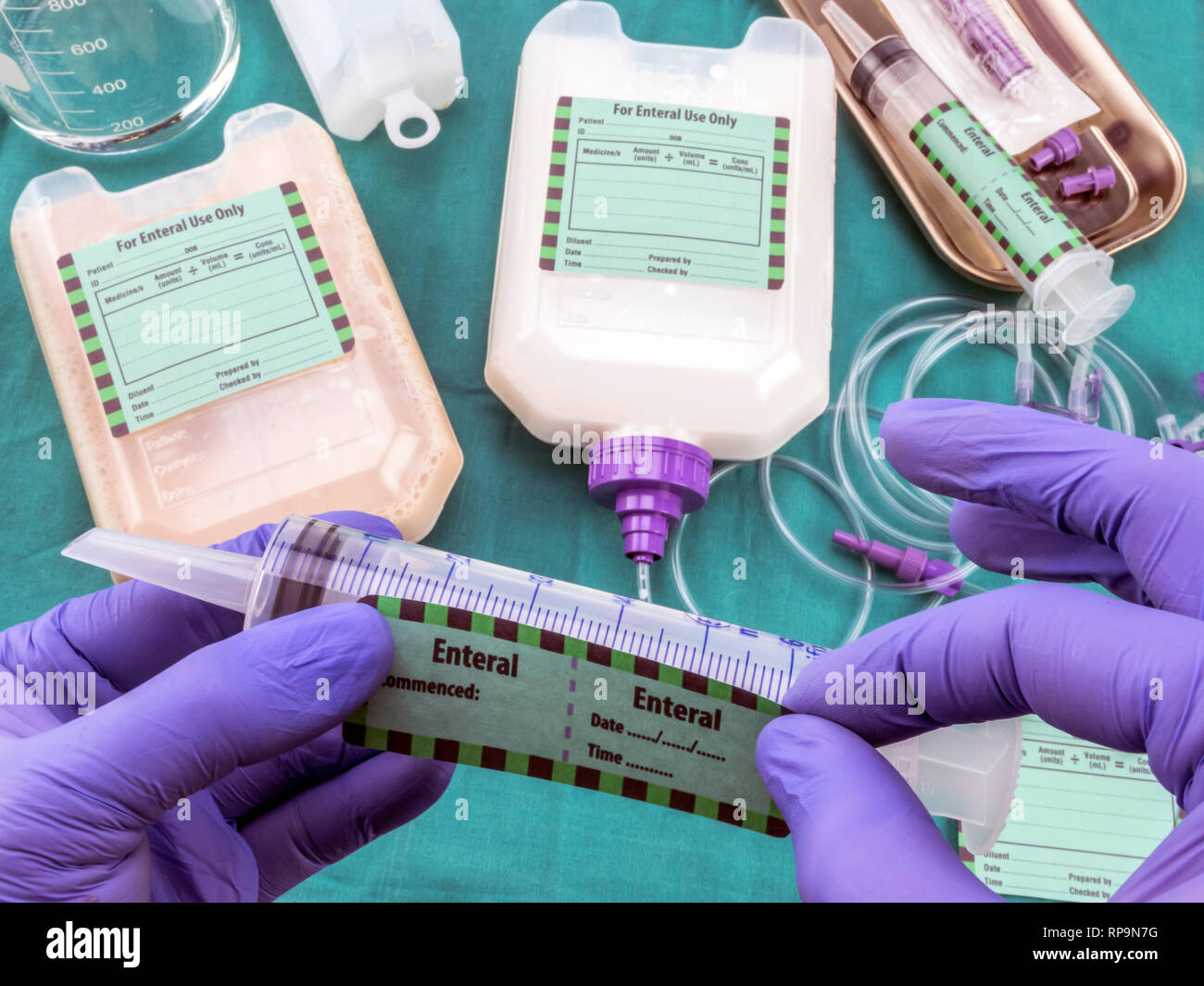 Nurse placed label on syringe of enteral nutrition, palliative care in ...