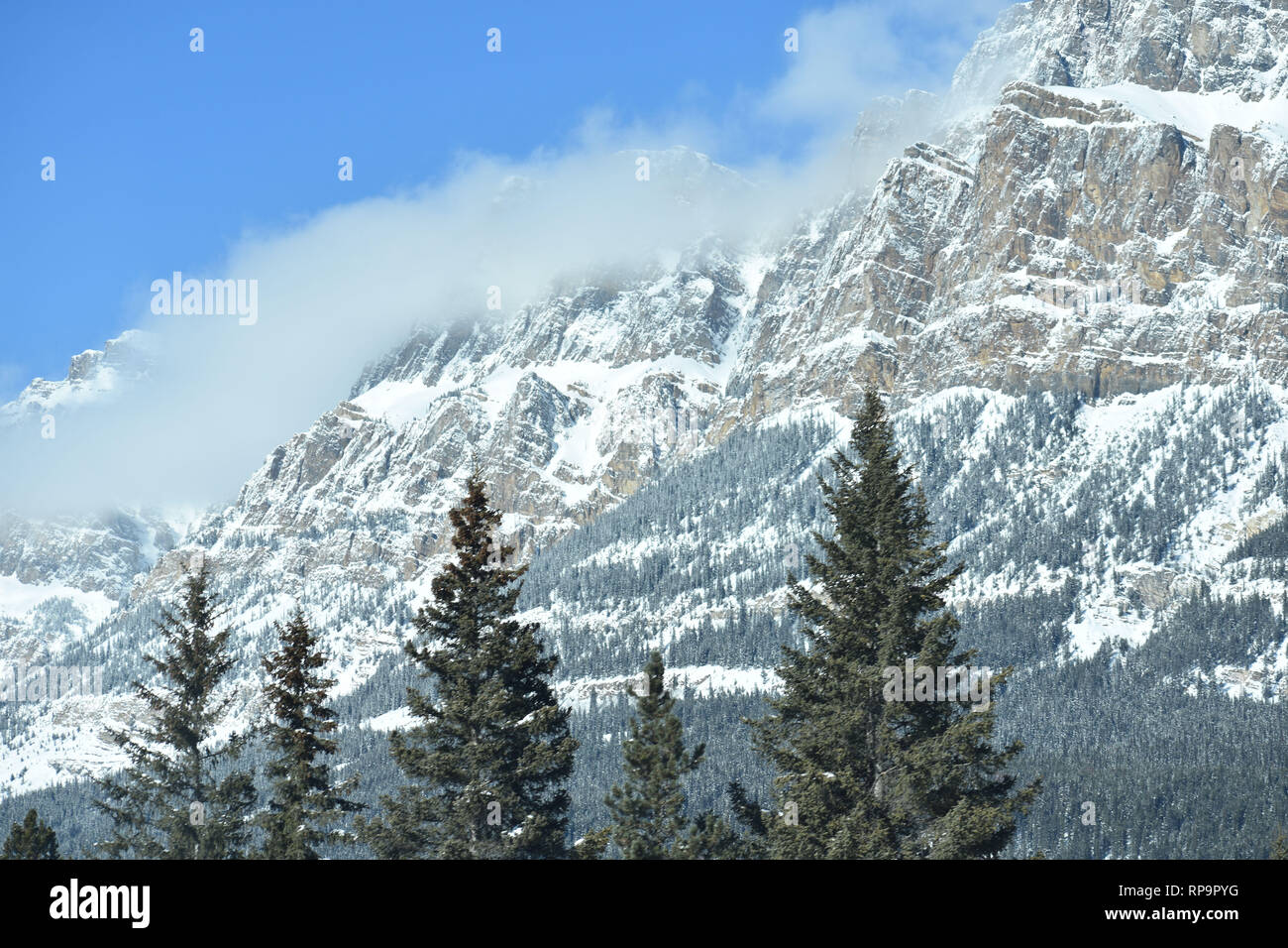 Cloud climbing Rocky Mountains Stock Photo - Alamy