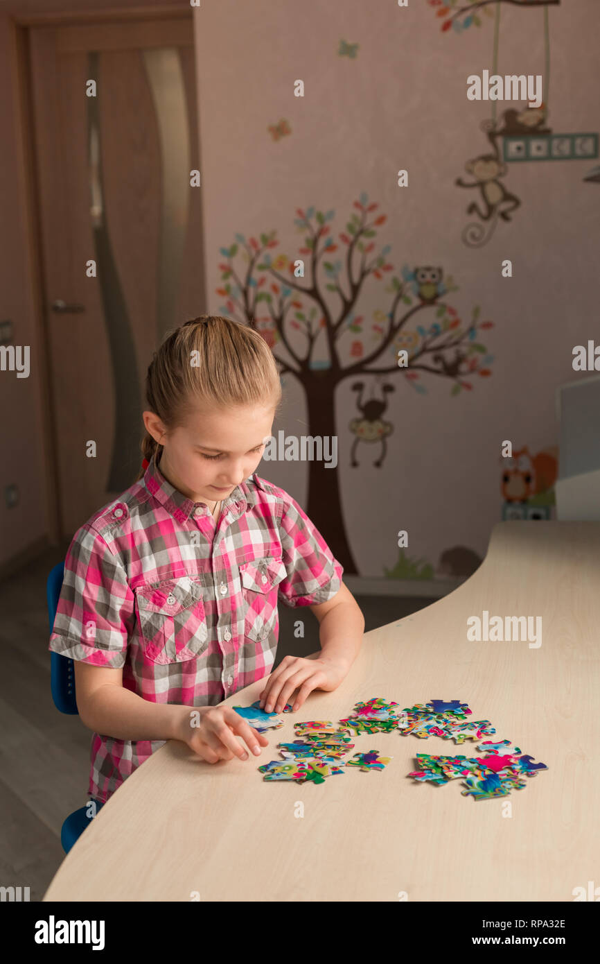 Children playing together jigsaw puzzle hi-res stock photography and ...