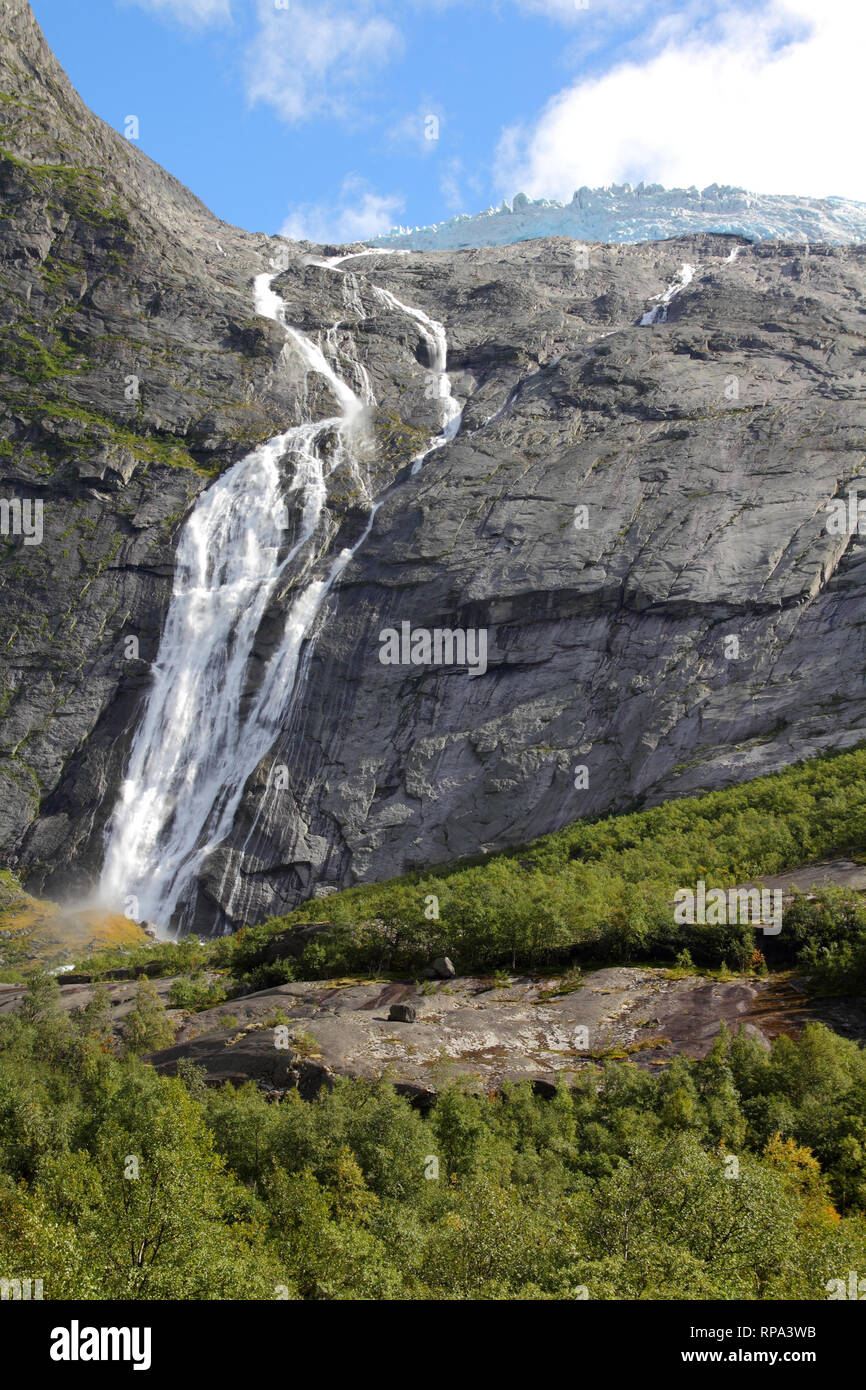 Norway, Jostedalsbreen National Park. Waterfall originating from ...