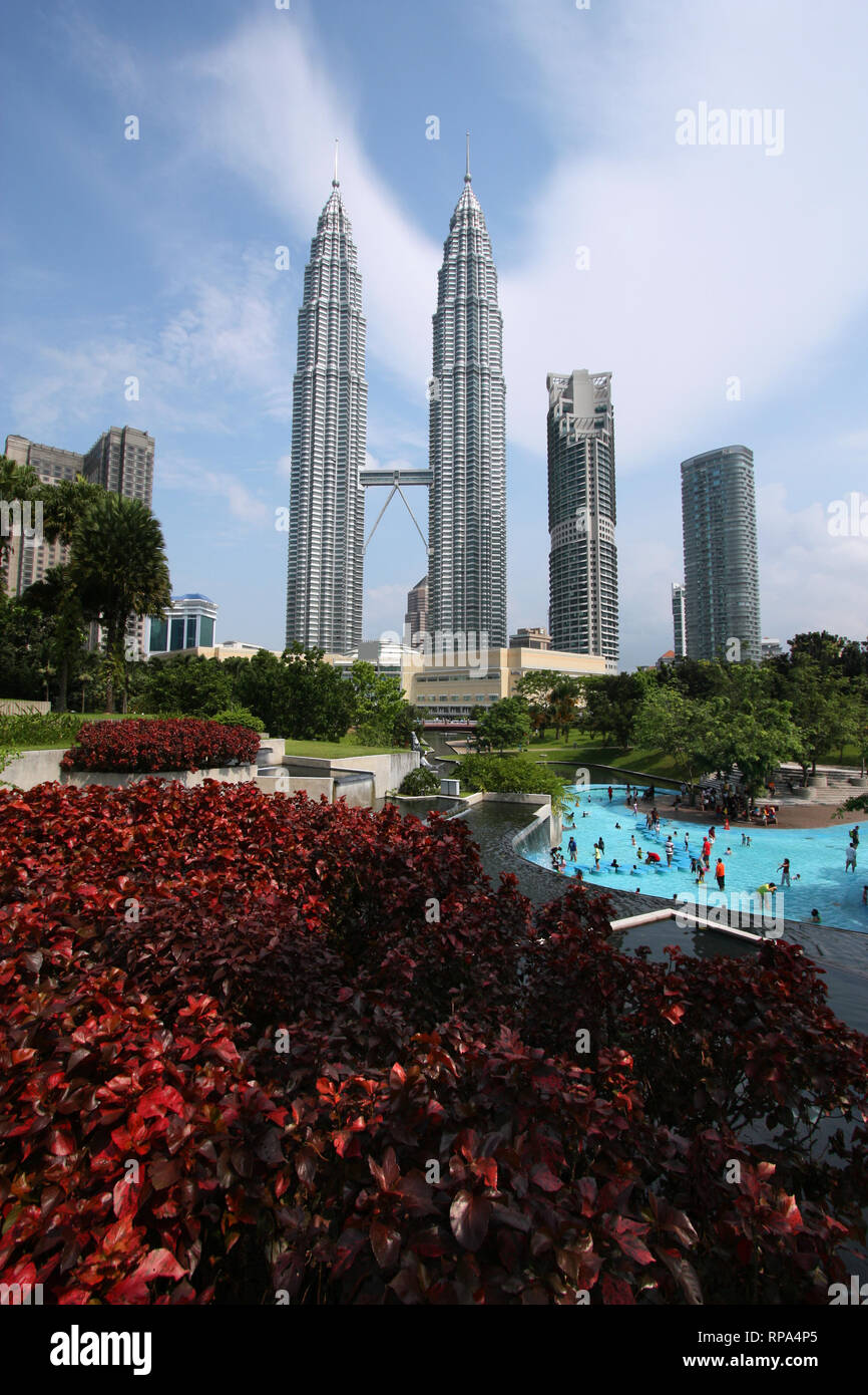 Kuala Lumpur, Malaysia - skyline with famous Petronas Towers. KLCC park ...