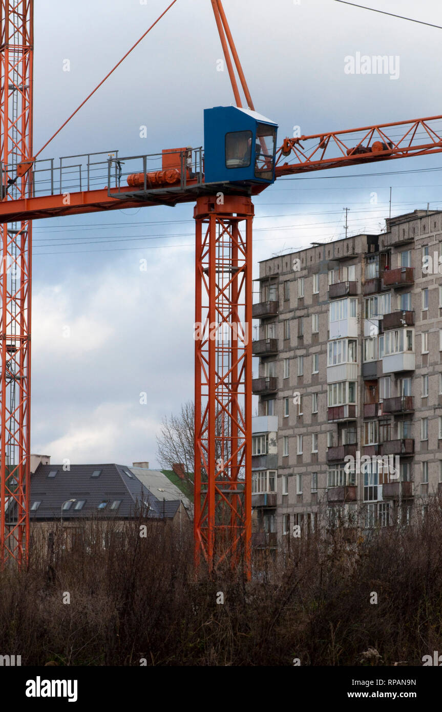 Crane loader lifting a load at construction site Stock Photo - Alamy