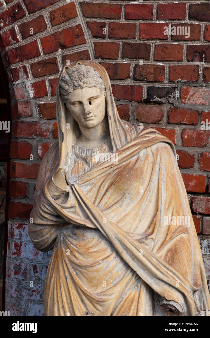 Holy Mary statue portrait. Ancient statue near a brick wall Stock Photo ...