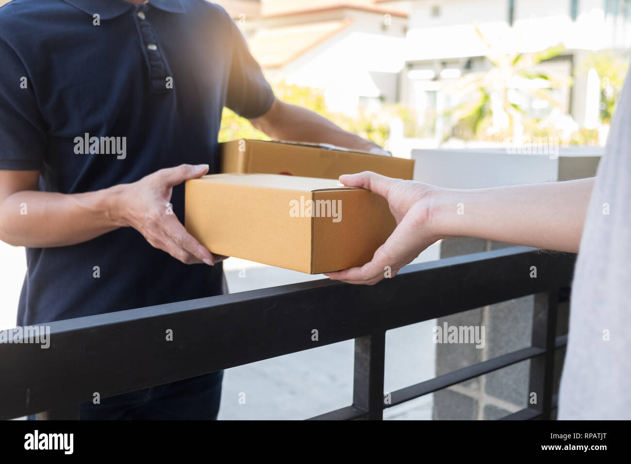 delivery service concept, customer hand receiving a cardboard boxes ...