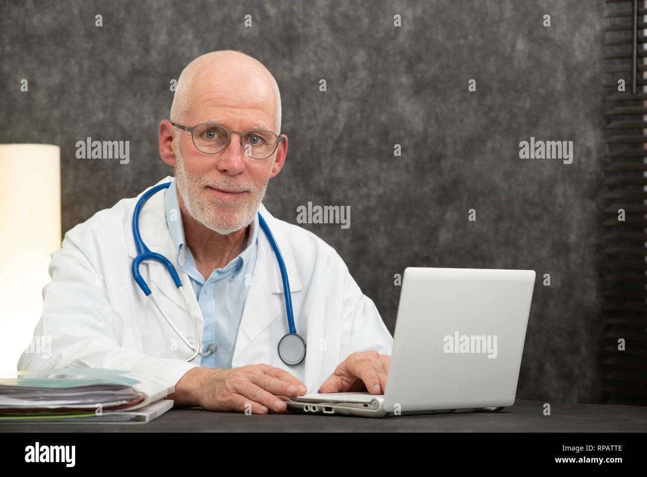 Handsome elderly doctor in uniform hi-res stock photography and images ...