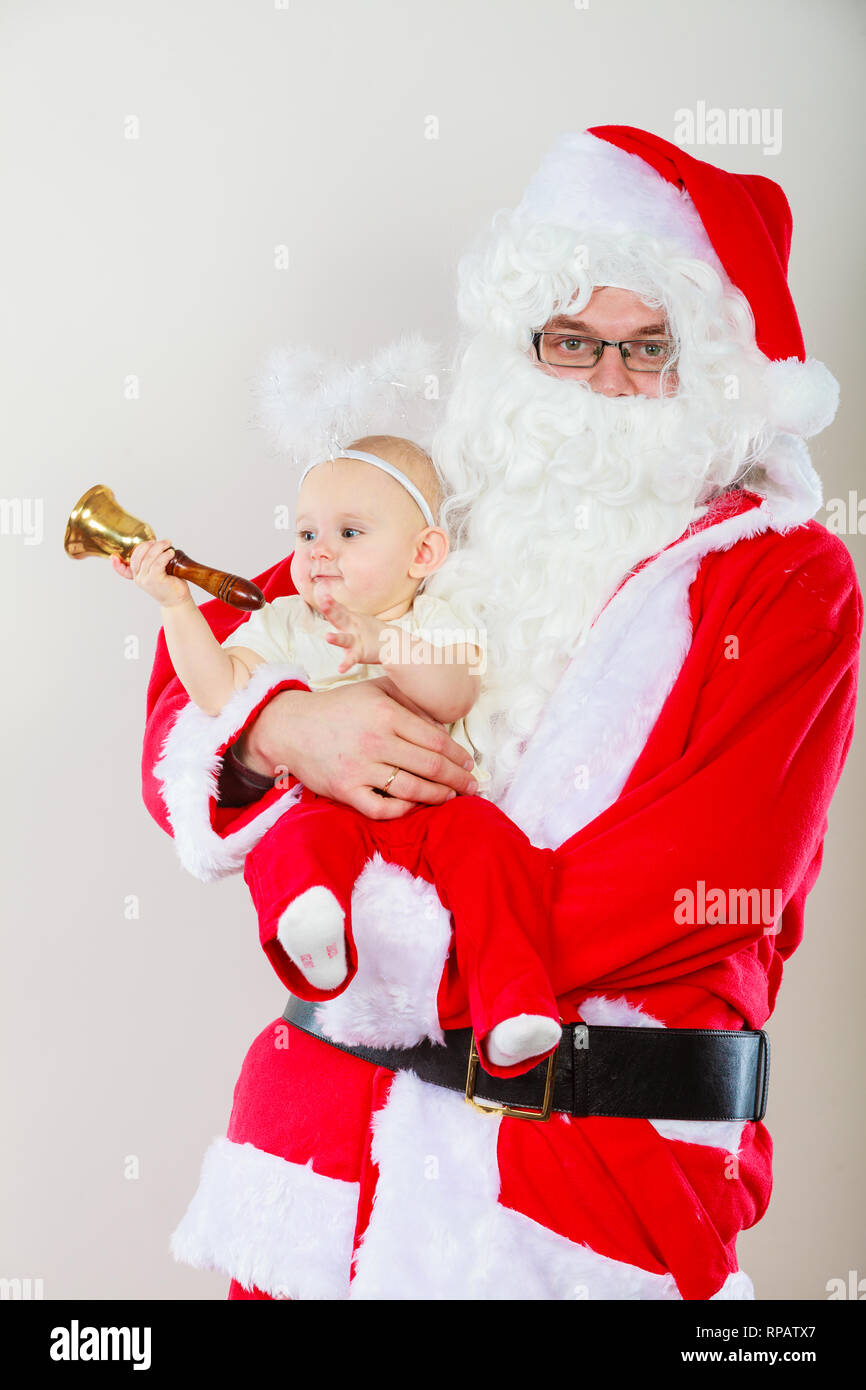 Christmas time people concept. Santa claus with little baby. Man has ...