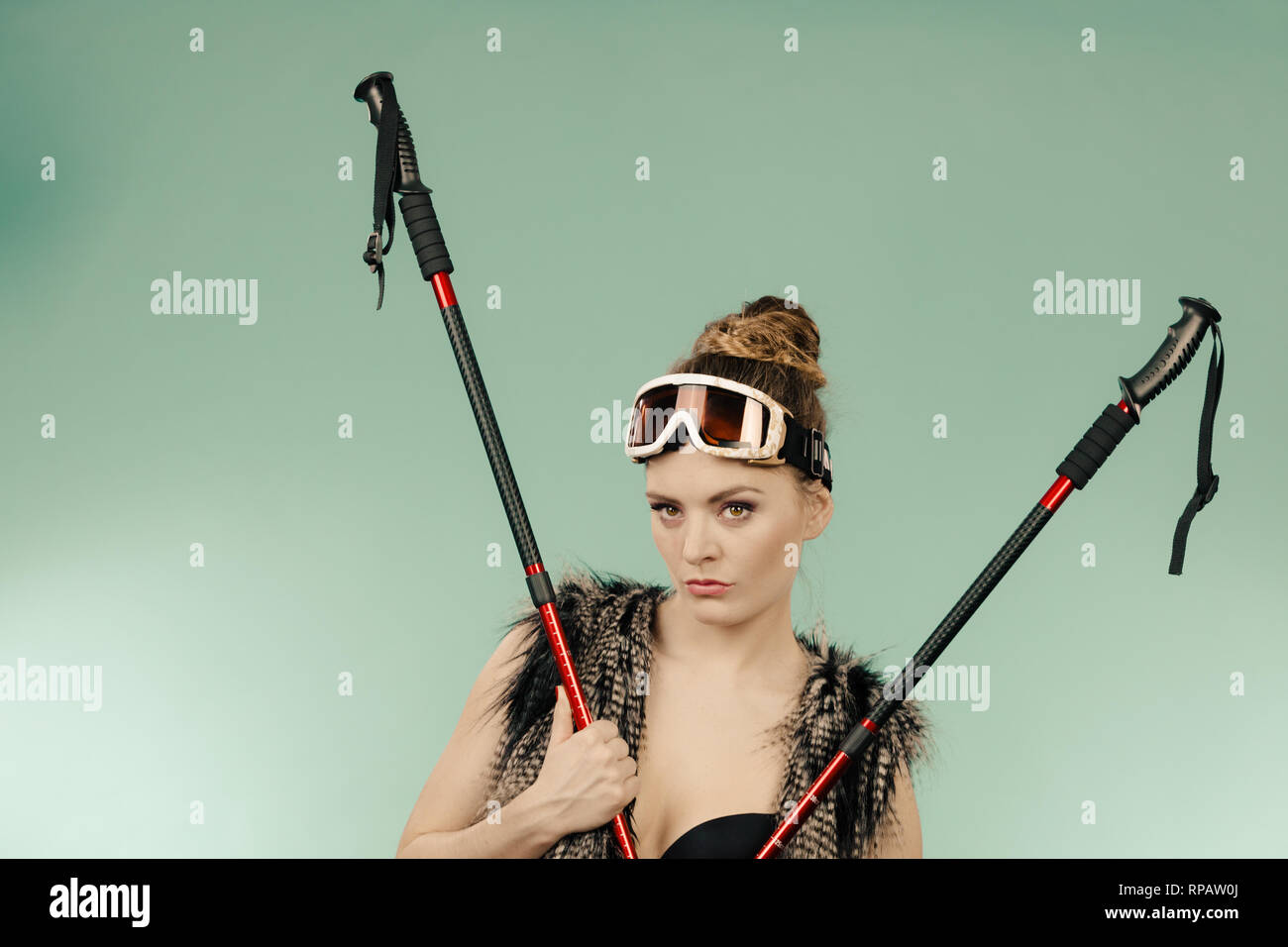 Winter sport activity concept. Atractive smiling girl wearing black bra ...