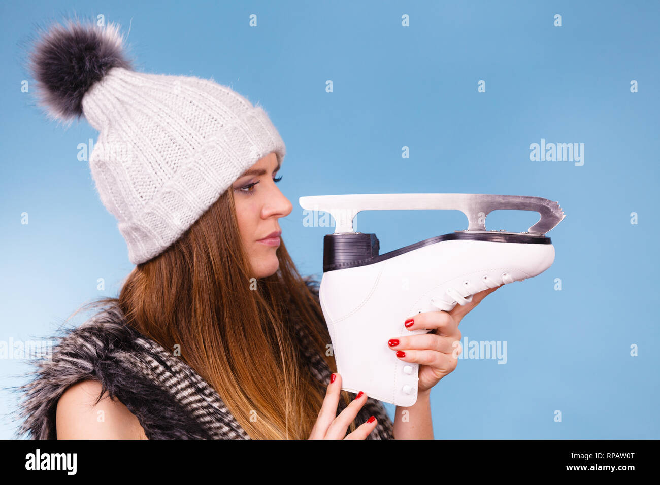 Winter sport activity concept. Girl wearing warm hat and furry ... Winter sport activity concept. Girl wearing warm hat and furry ...