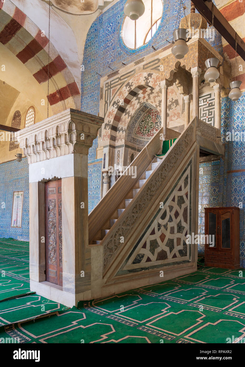 Blue, Iznik ceramic tiles wall with engraved Mihrab (niche) and ...