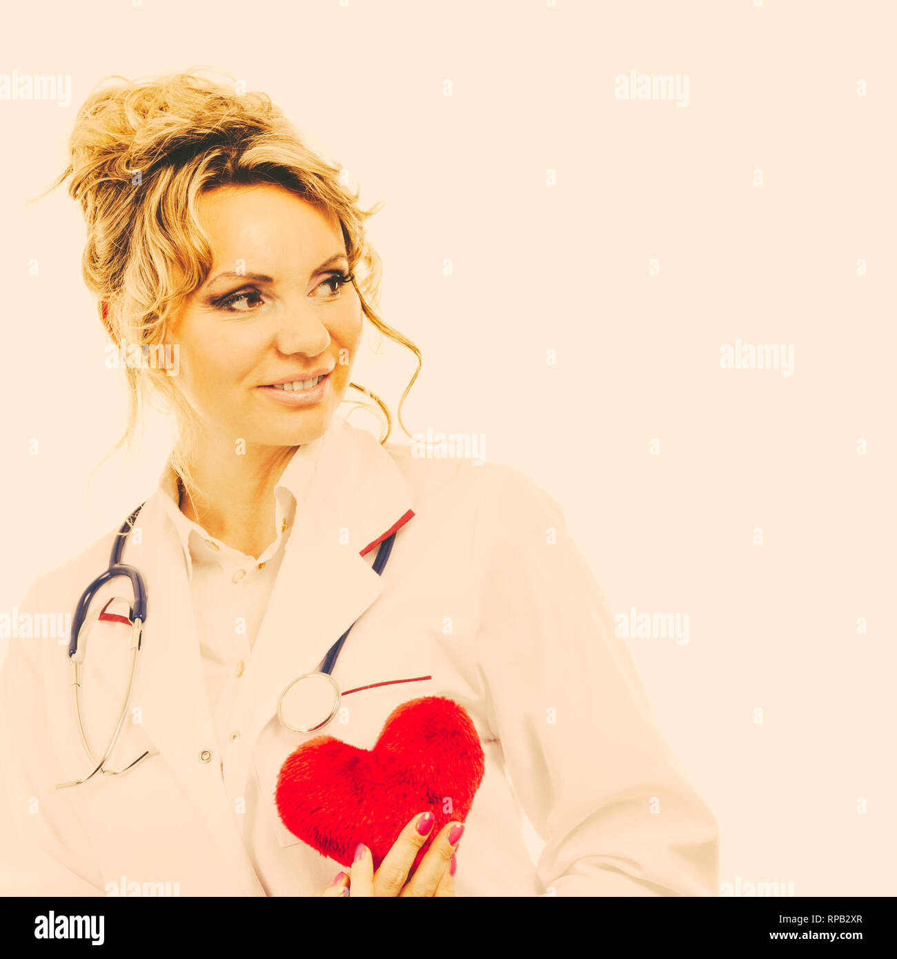 Periodic examinations. Cardiology concept. Female cardiologist holding ...