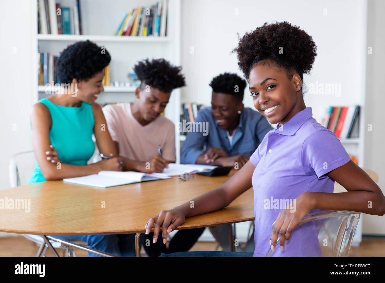 Pretty african american female student at classroom of university Stock ...