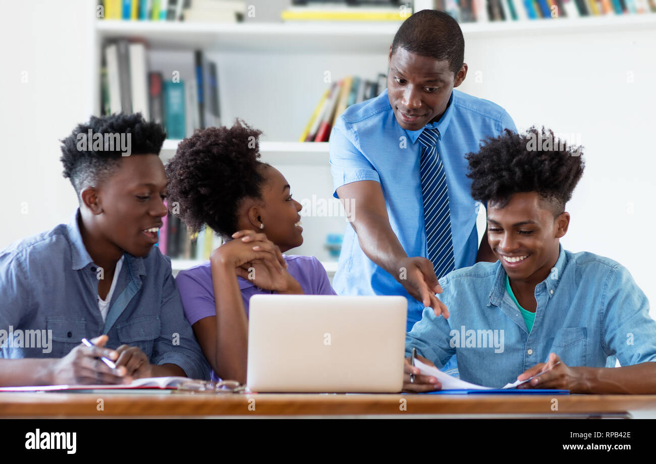 African american male professor with students at university Stock Photo ...
