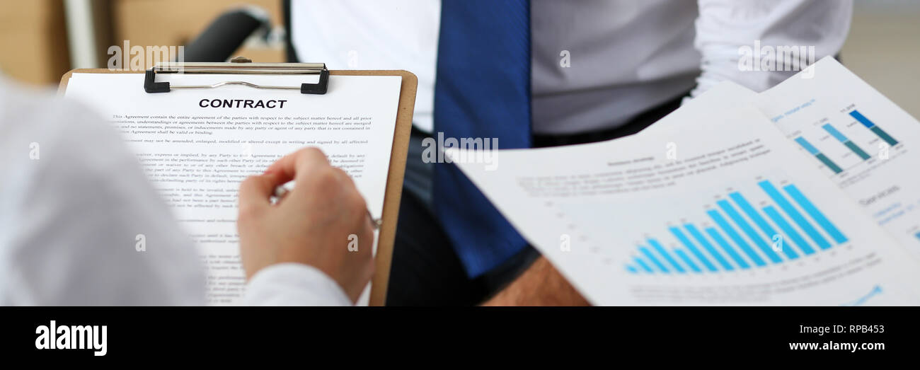 Male arm offer contract form on clipboard pad Stock Photo - Alamy