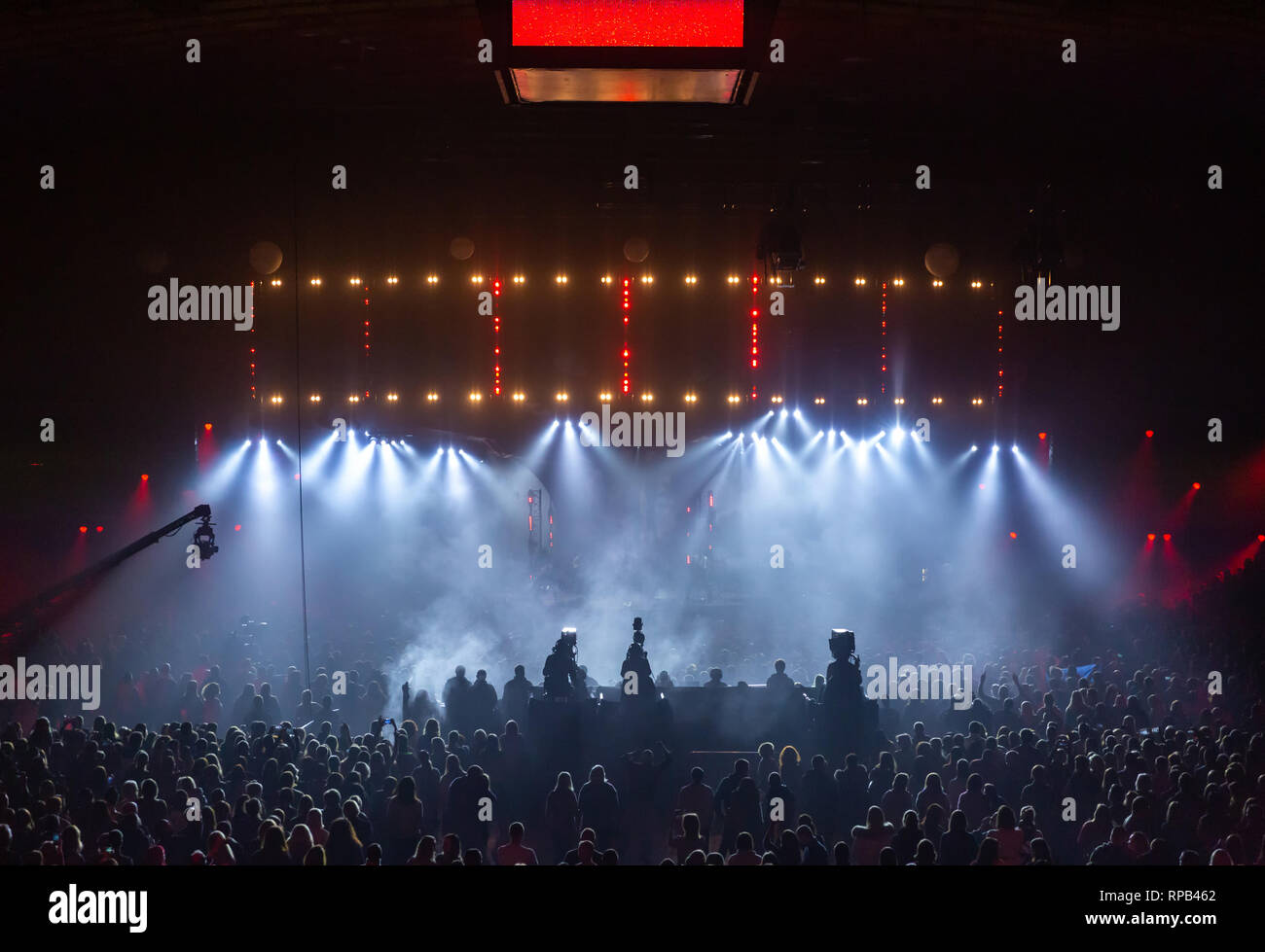 Concert crowd having fun at a rock concert. Large concert hall with a ...