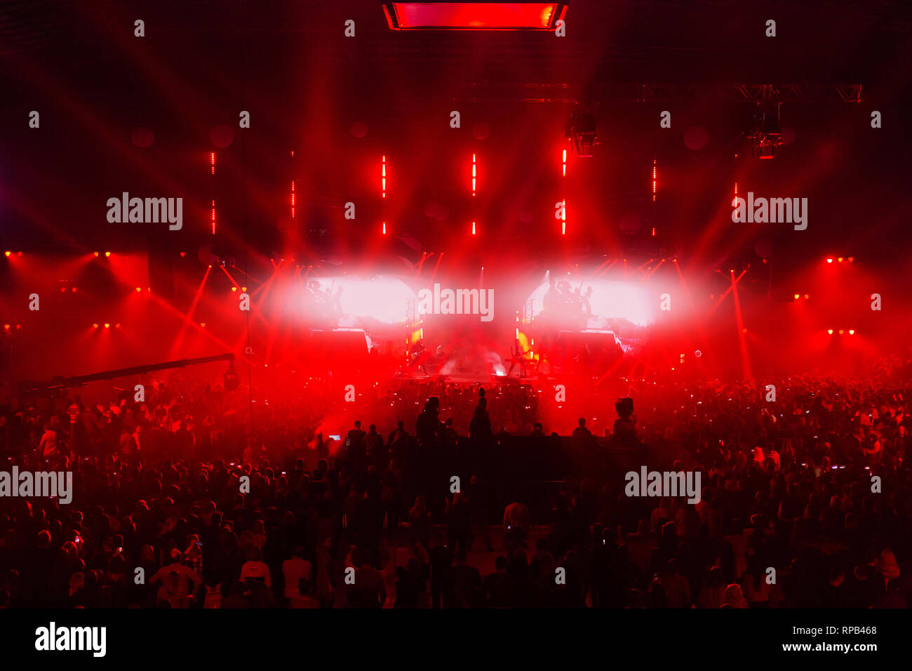 Concert crowd having fun at a rock concert. Large concert hall with a ...