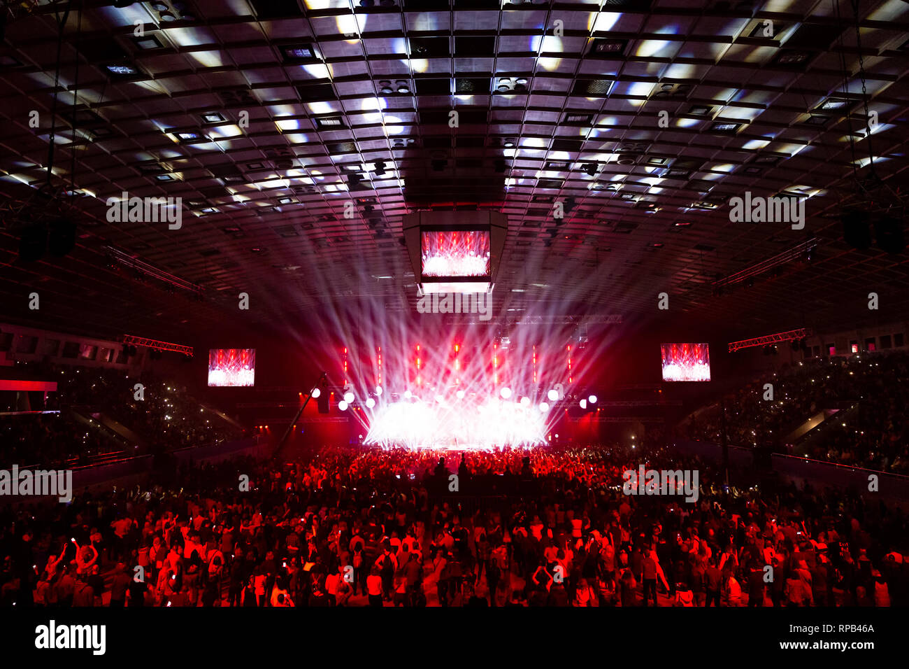 Concert crowd having fun at a rock concert. Large concert hall with a ...
