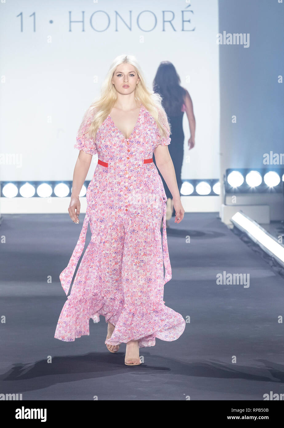 Model wearing dress by Ryan Lo walks runway for 11 Honore fashion show ...