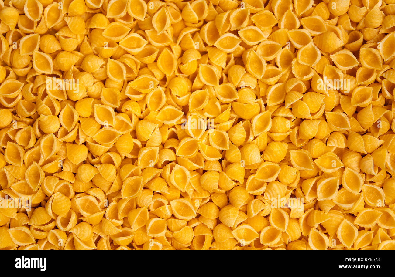 Shell macaroni pasta making a background pattern Stock Photo - Alamy