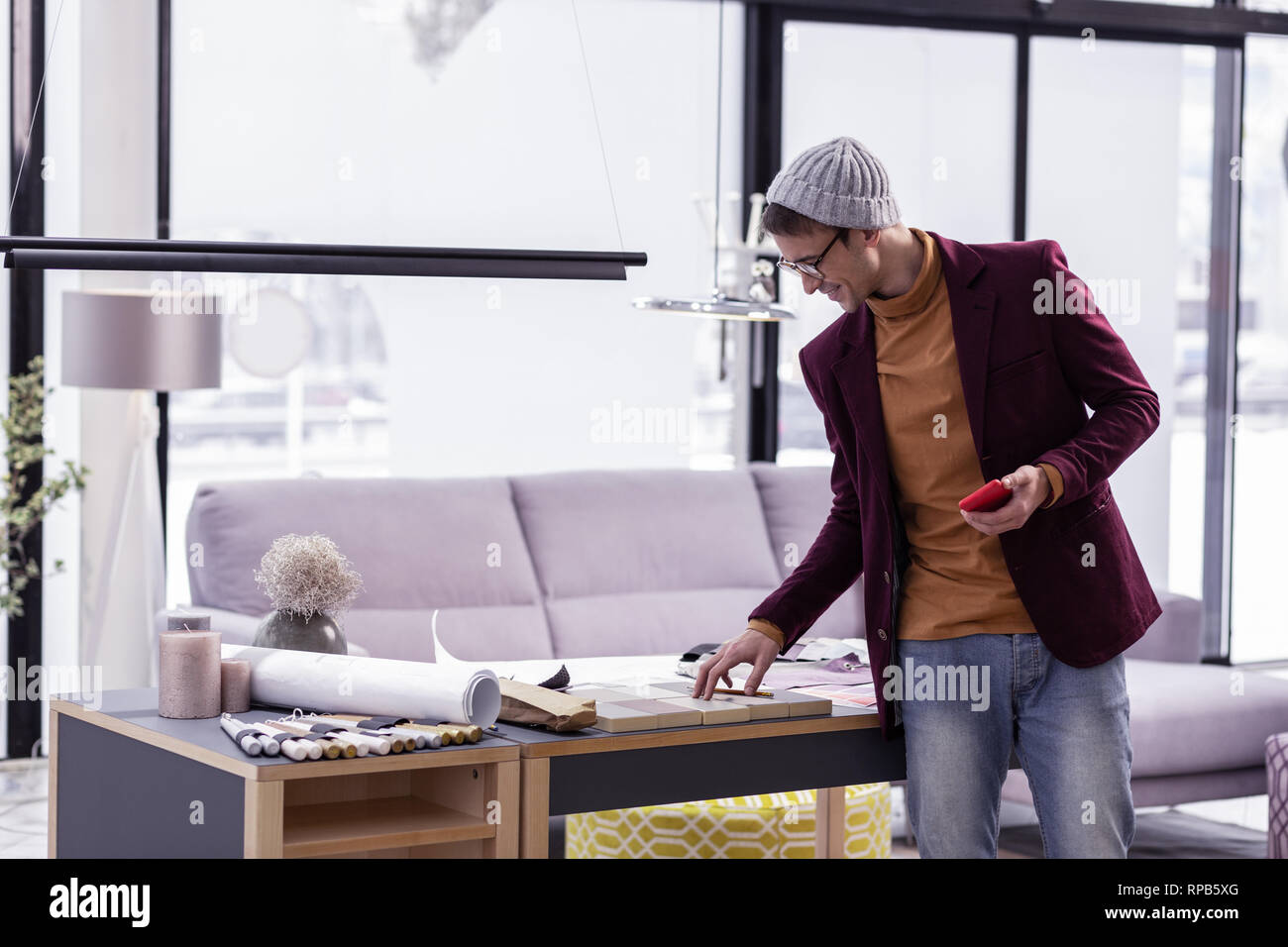 Trendy worn athletically inclined adult mister selecting samples in ...