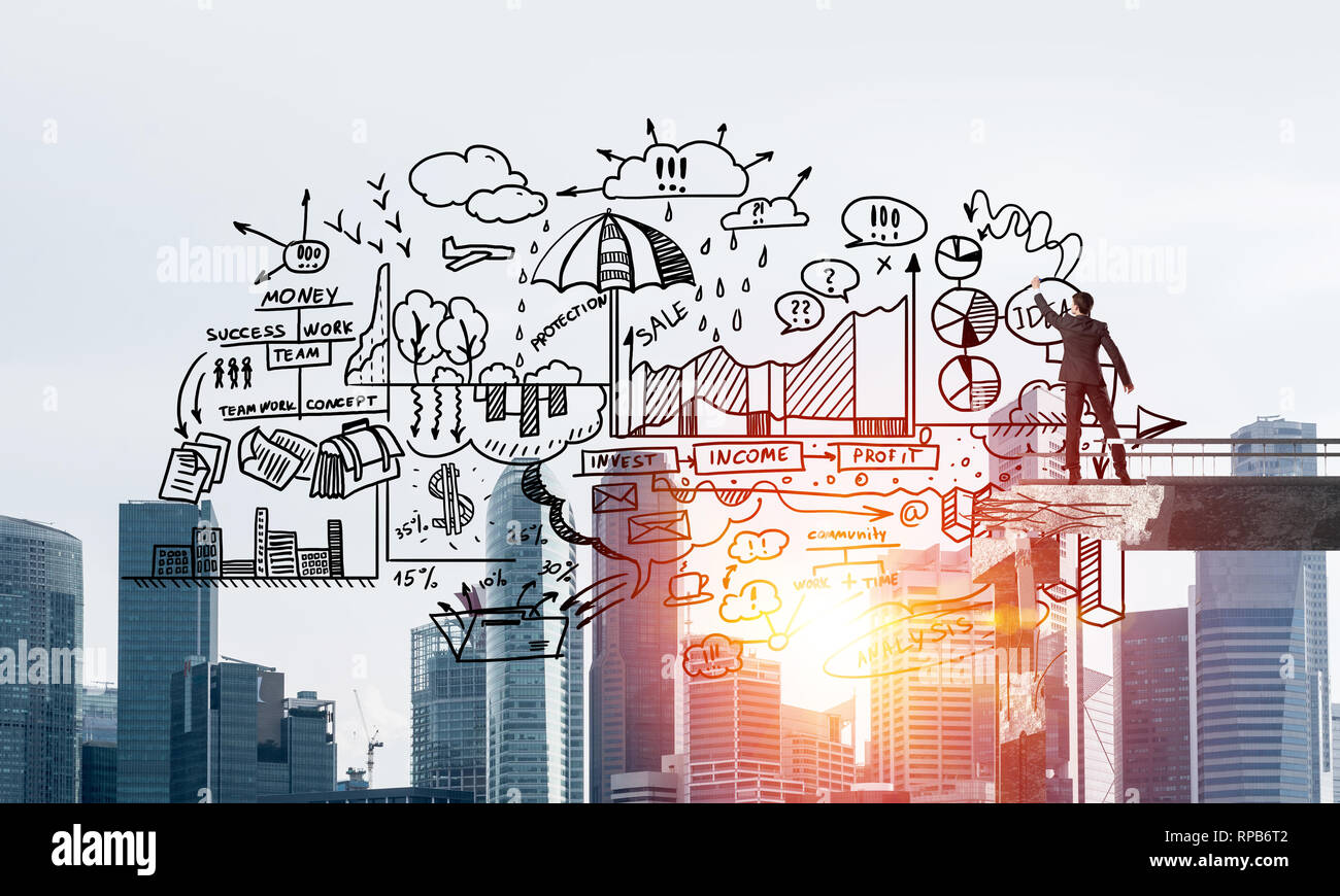 Businessman drawing business conceptual sketches Stock Photo - Alamy