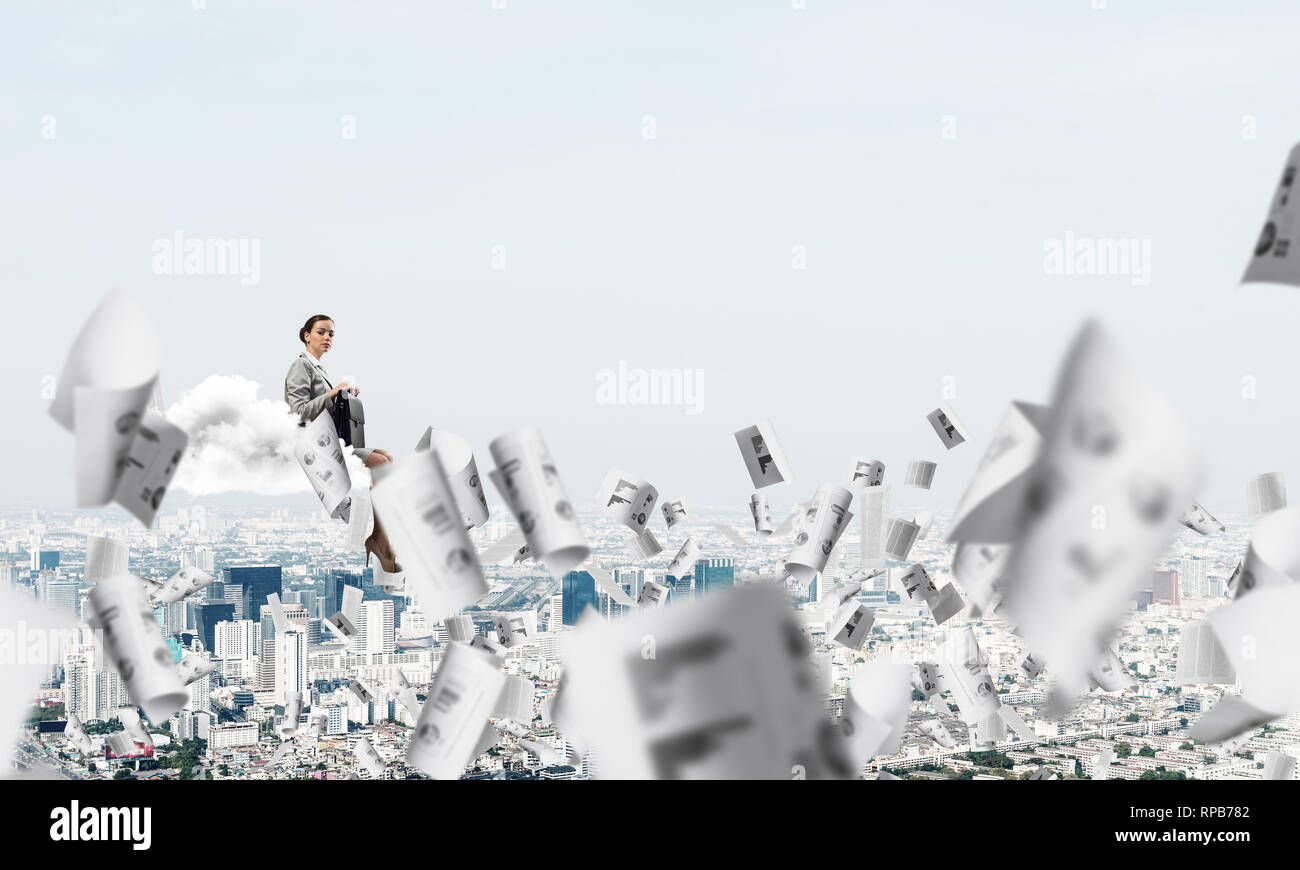 Woman float above city on cloud and papers flying around Stock Photo ...