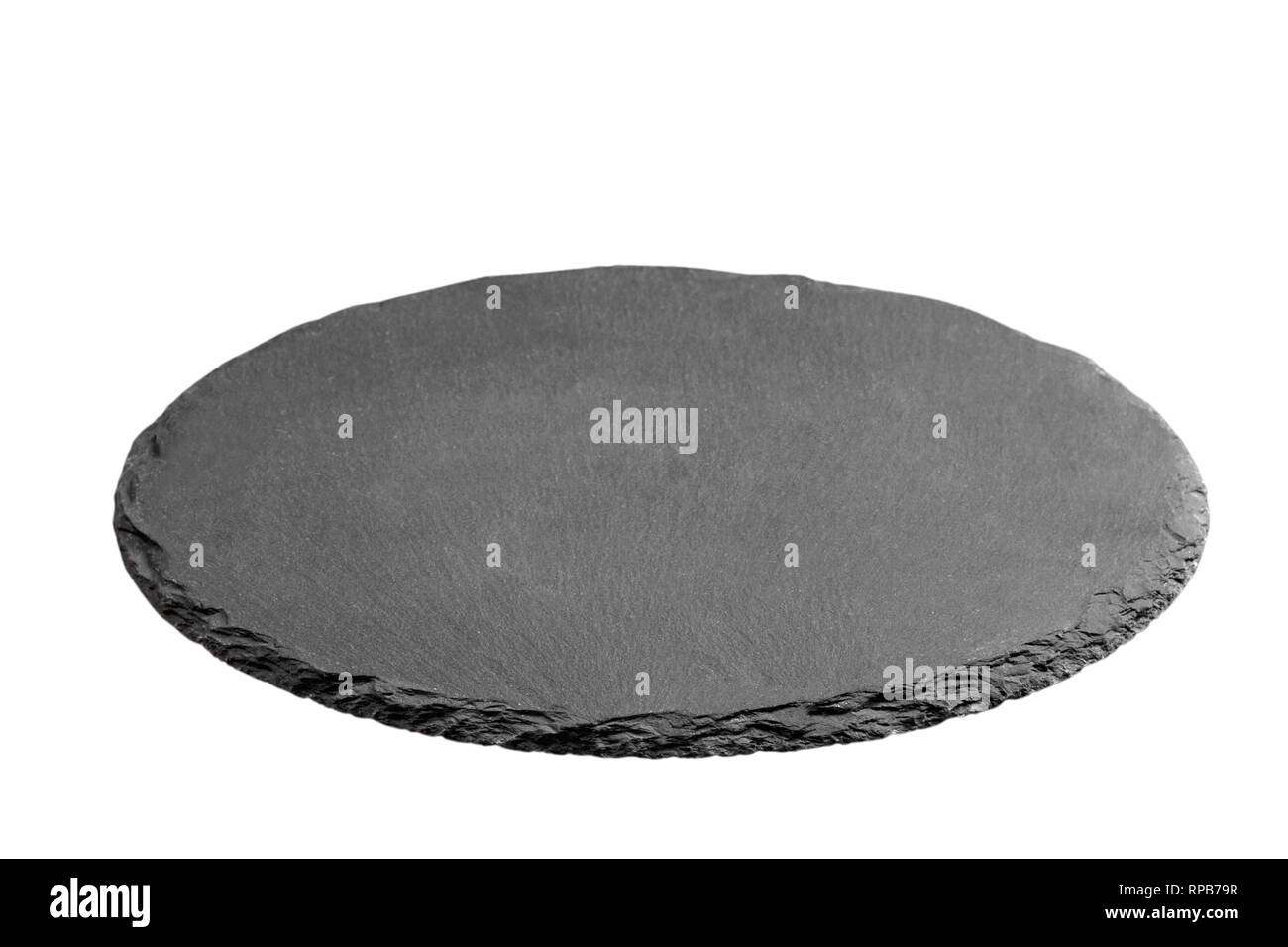 Slate plate on table. black slate stone isolated on white background ...