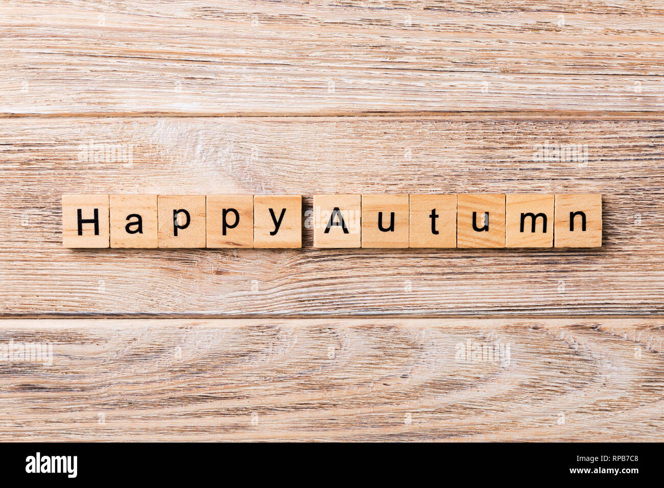 Happy autumn word written on wood block. Happy autumn text on wooden ...