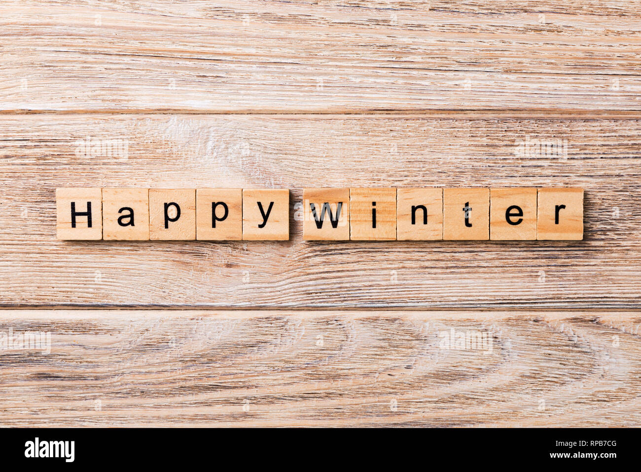 Happy winter word written on wood block. Happy winter text on wooden ...