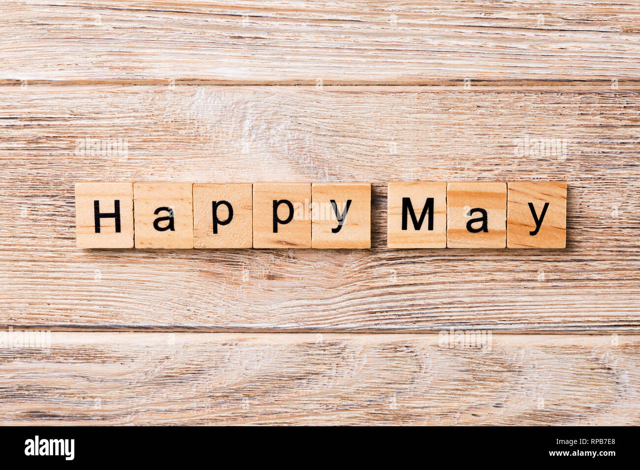 Happy May word written on wood block. Happy May text on table, concept ...