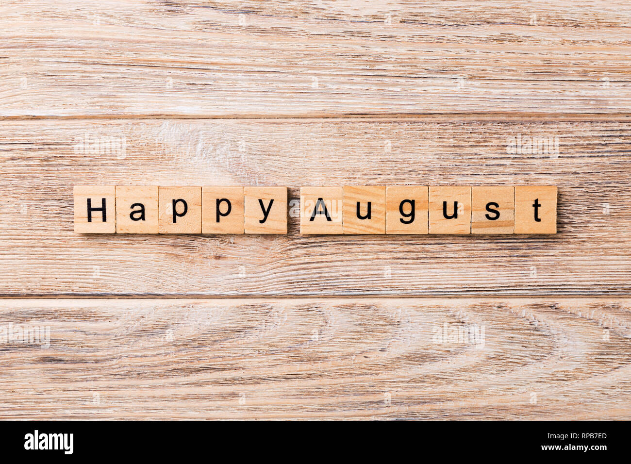 Happy august word written on wood block. Happy august text on table ...