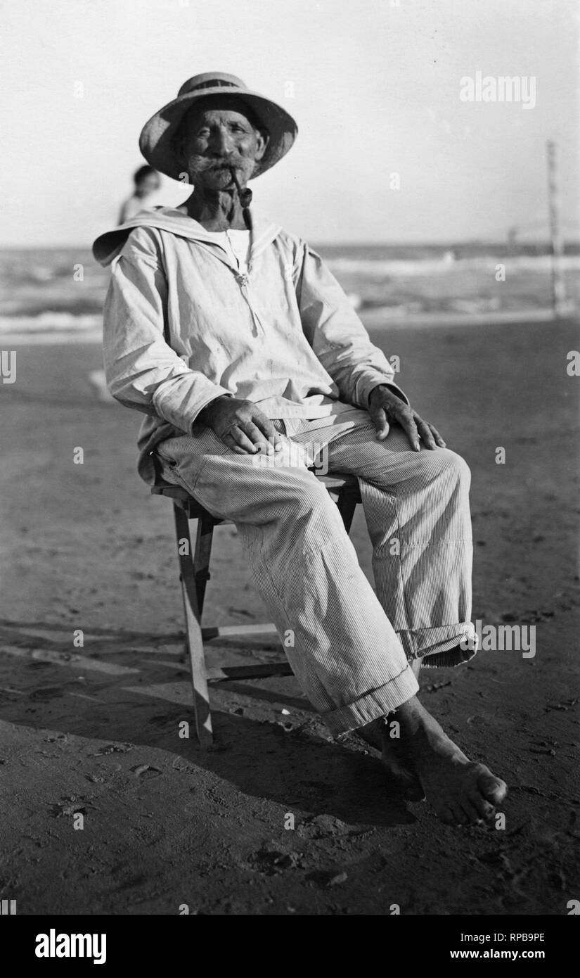 Man smoking on beach Black and White Stock Photos & Images - Alamy