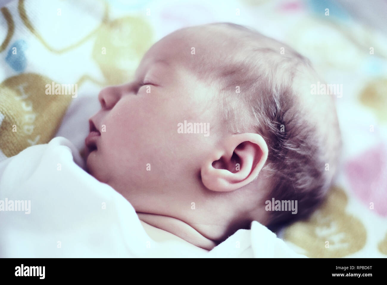 Newborn baby peacefully sleeping in hi-res stock photography and images ...