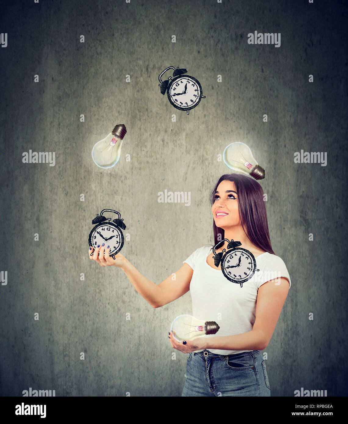 Smart time management concept. Happy young woman juggling bright ...