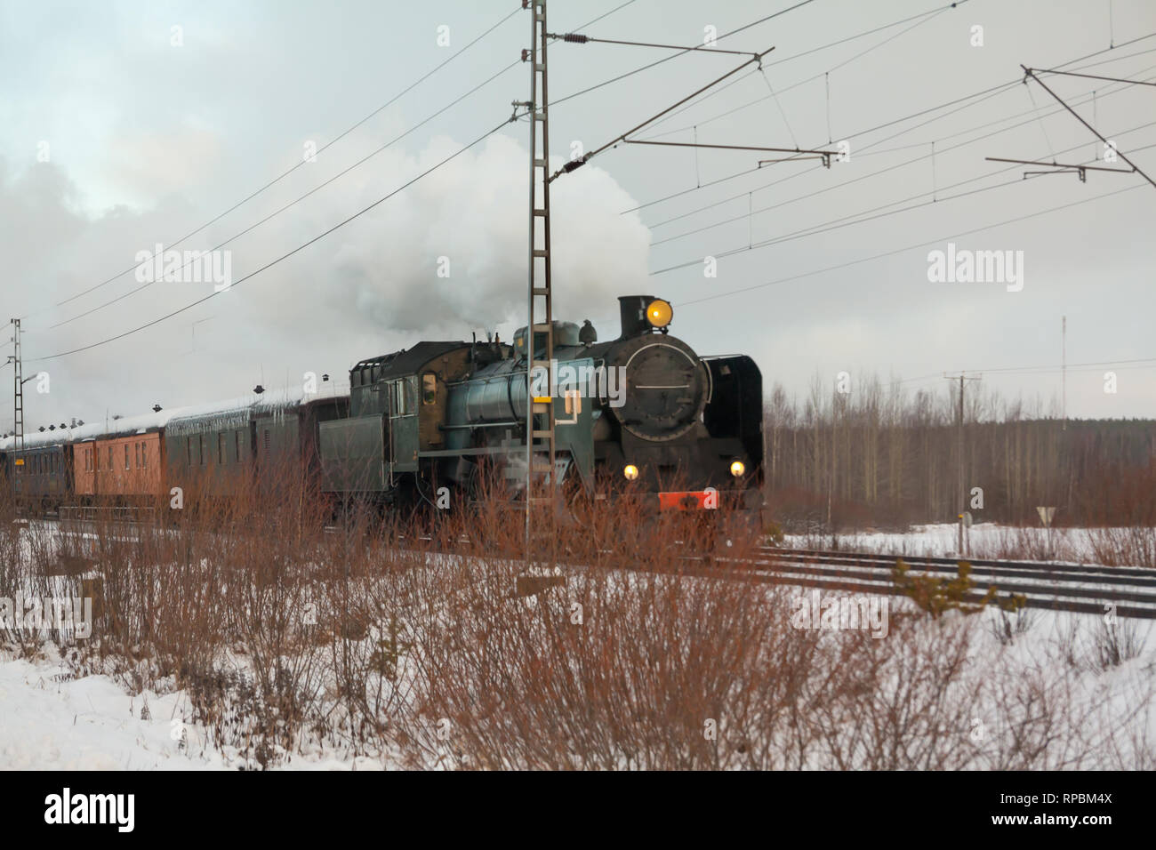 Old retro steam train at winter morning in Finland Stock Photo - Alamy