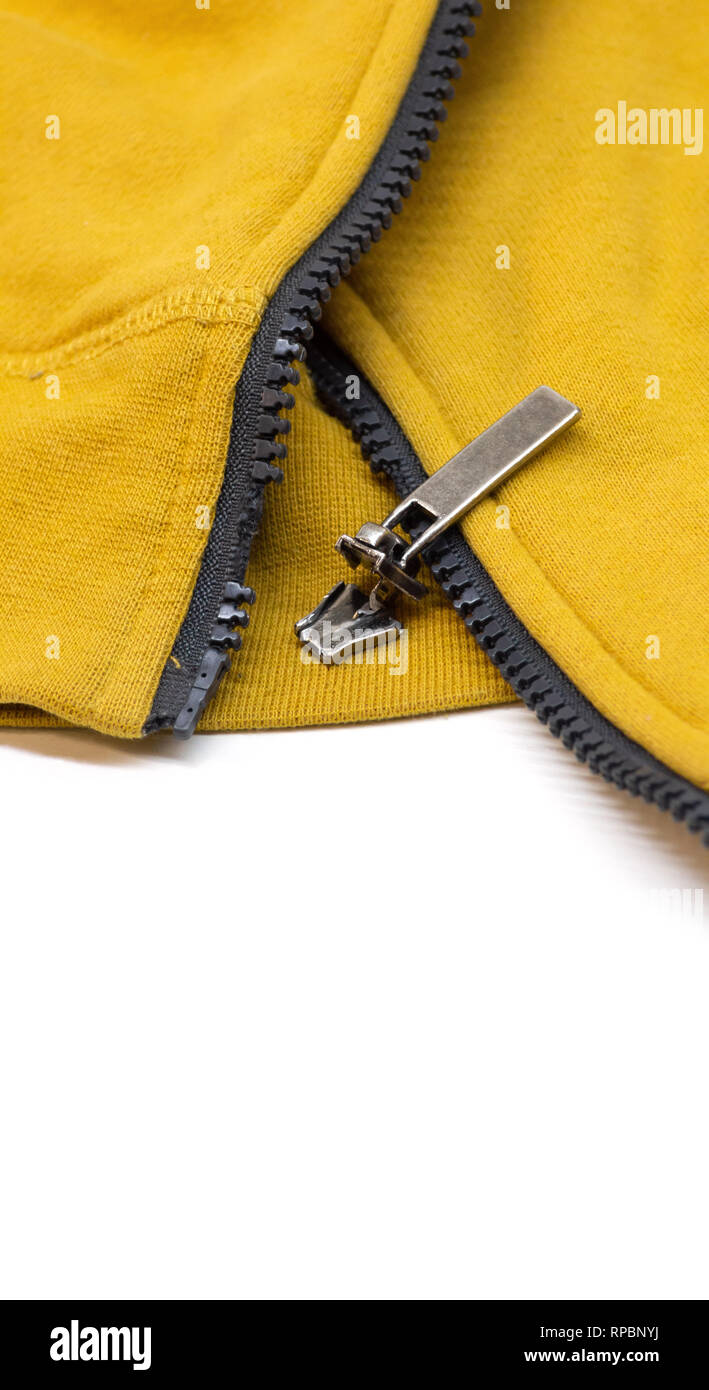 Broken zipper on yellow, color of mustard shirt jacket. Detail close-up ...