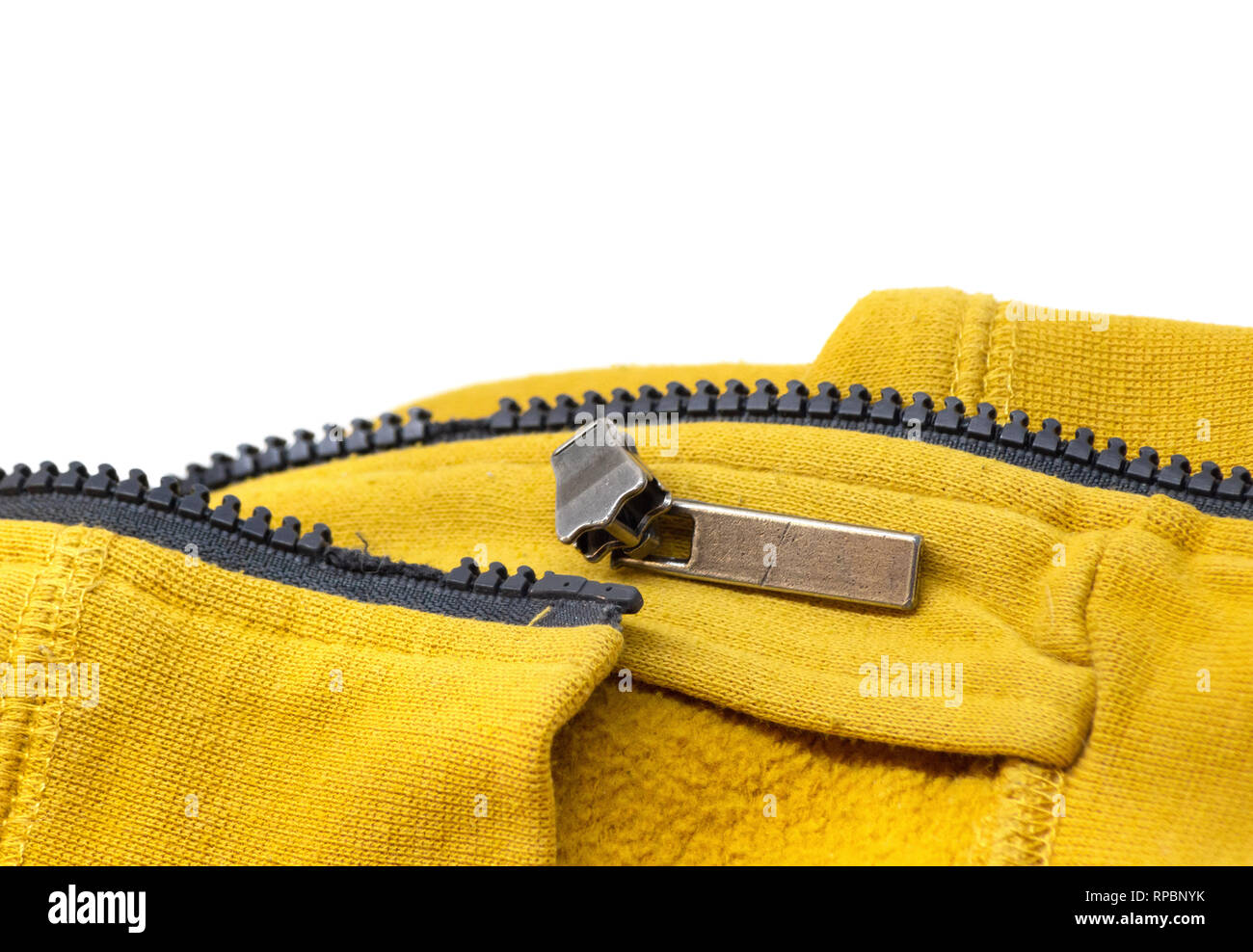 Broken zipper on yellow, color of mustard shirt jacket. Detail close-up ...
