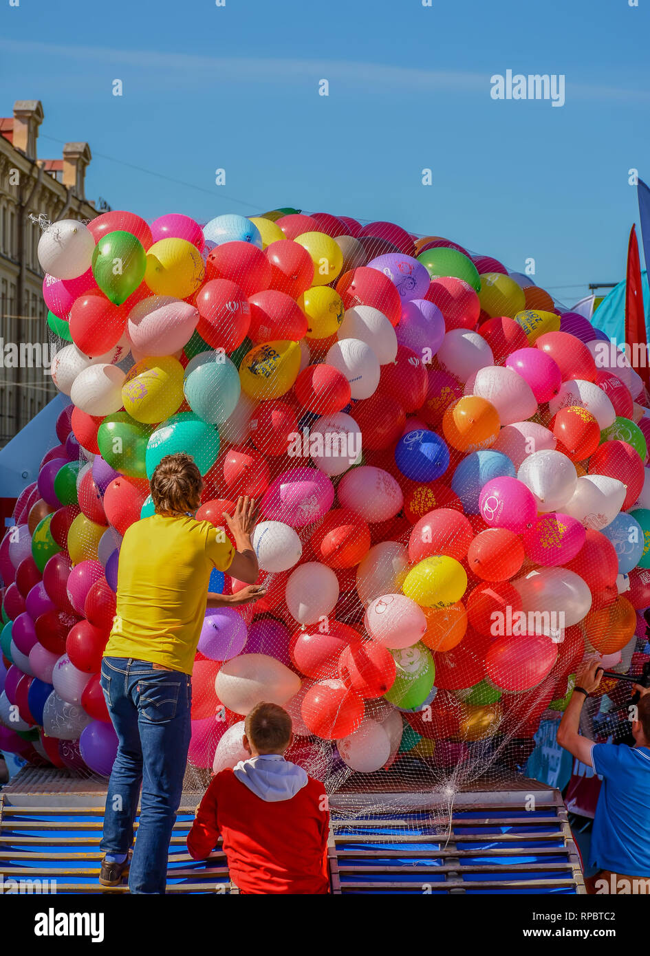 Colorful balloons in the blue spring sky Stock Photo - Alamy