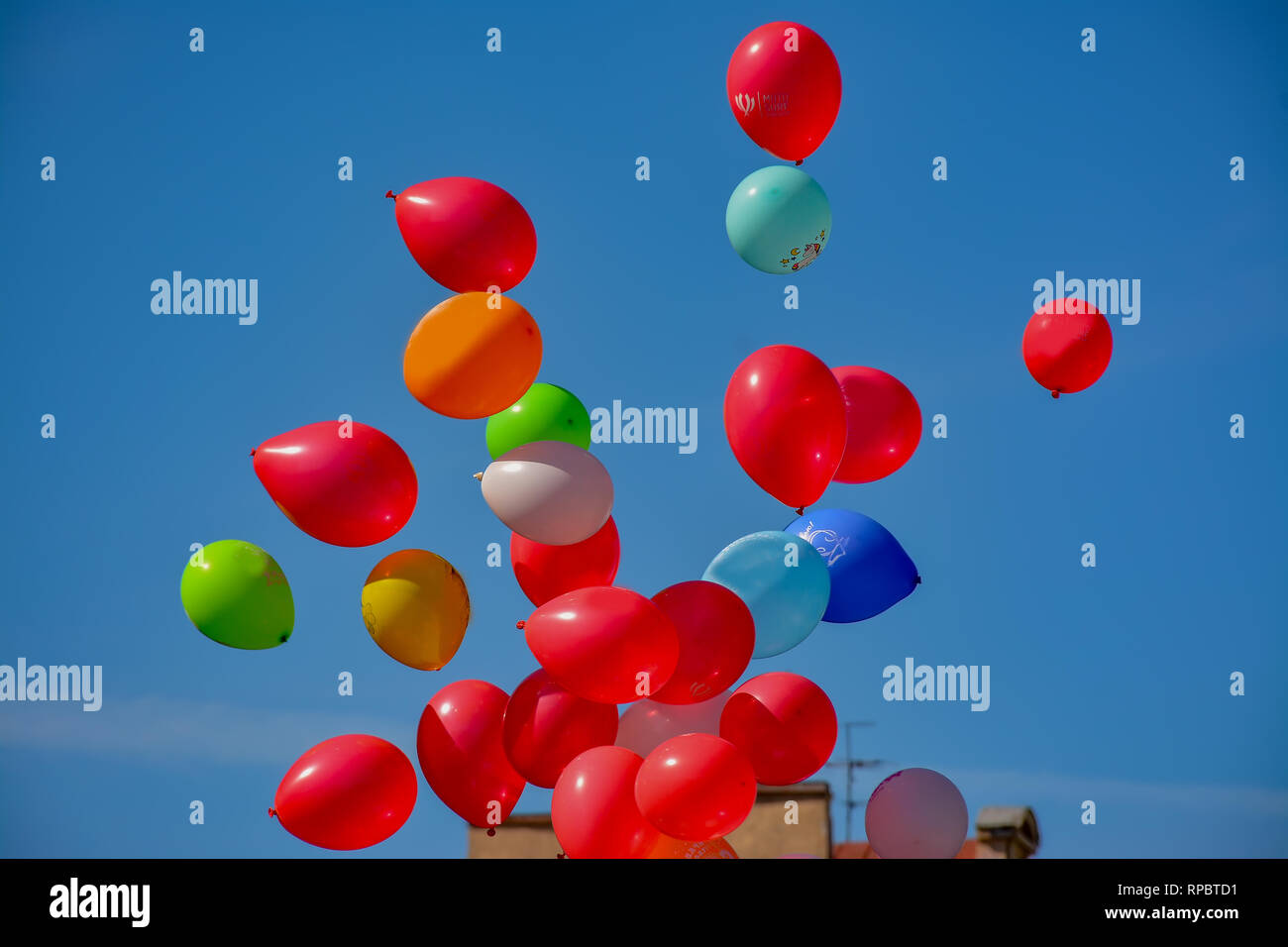 Colorful balloons in the blue spring sky Stock Photo - Alamy