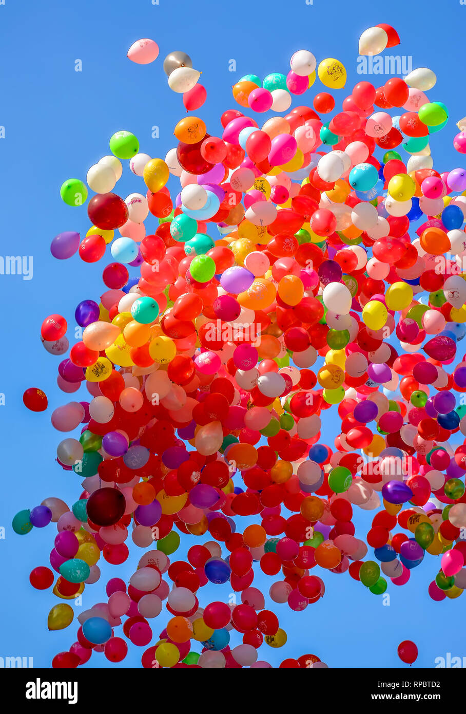 Colorful balloons in the blue spring sky Stock Photo - Alamy