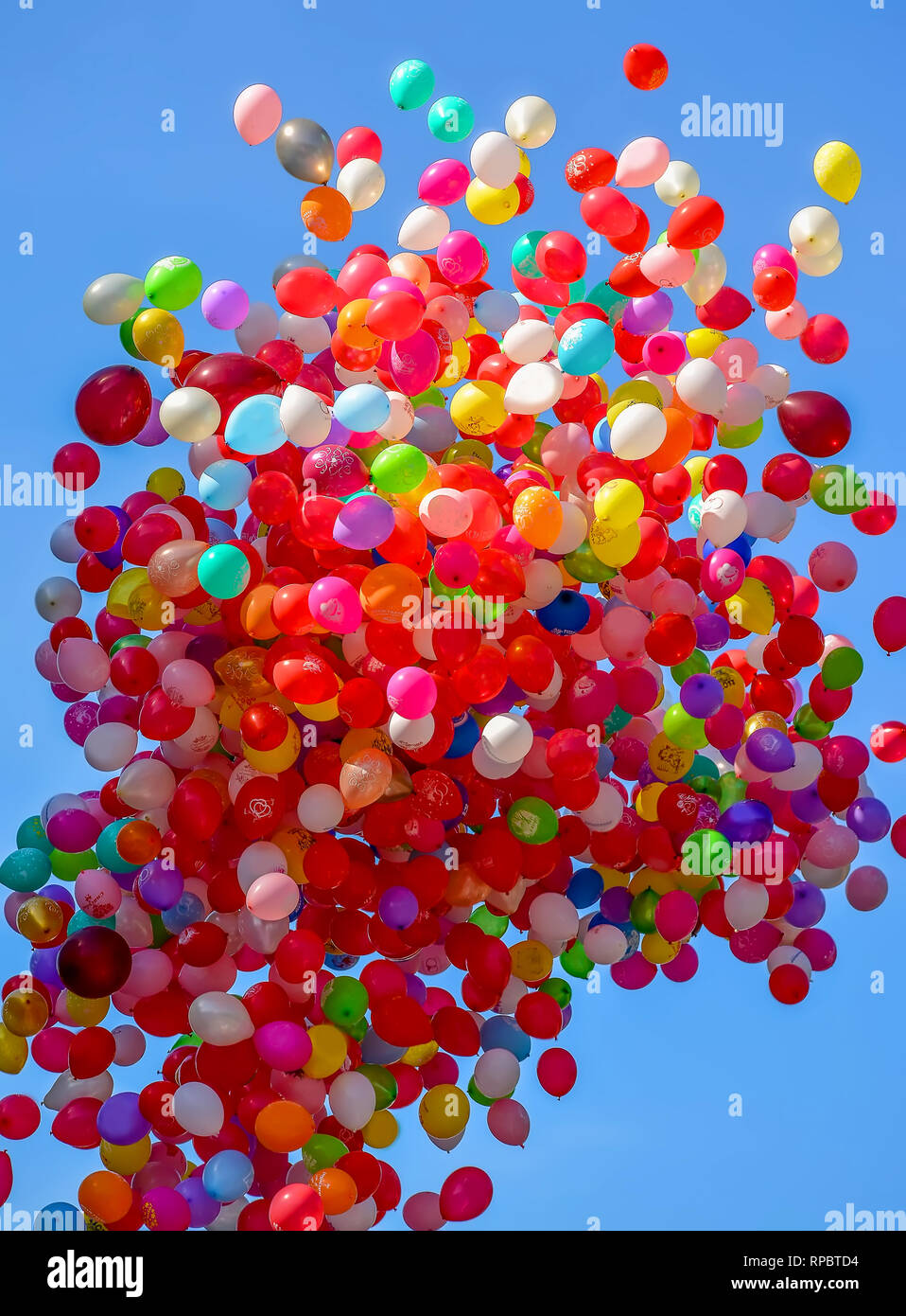 Colorful balloons in the blue spring sky Stock Photo - Alamy
