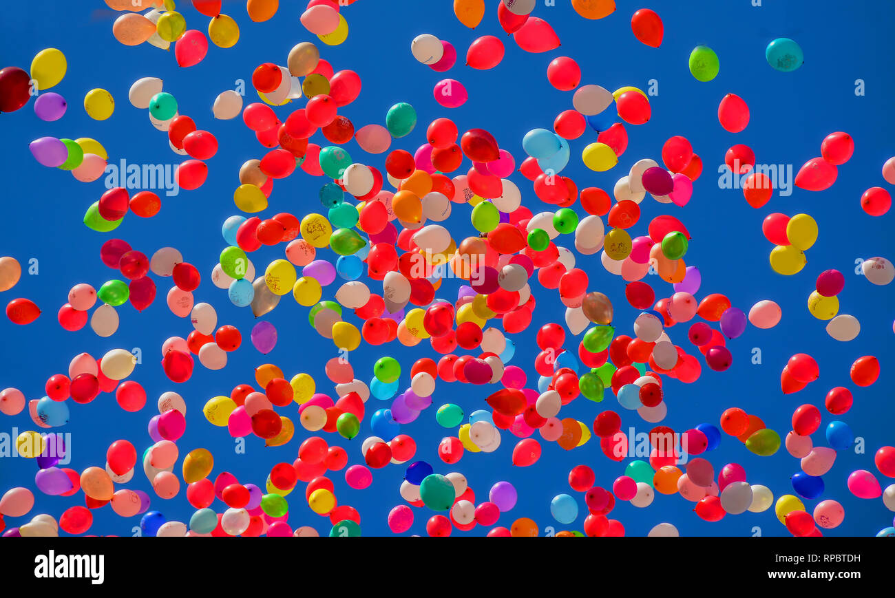 Colorful balloons in the blue spring sky Stock Photo - Alamy