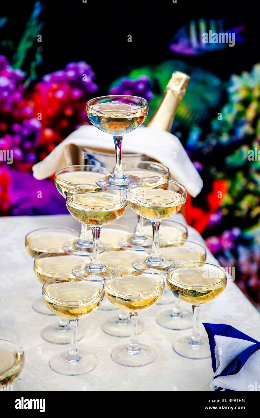 Champagne glasses standing in a tower at the party Stock Photo - Alamy