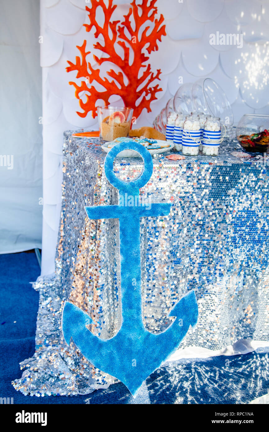 Blue anchor with sparkles near the candy bar on the children birthday ...