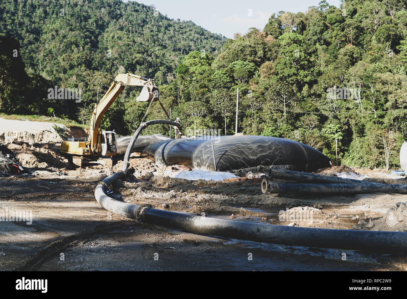 Sand dredging boat ,pump and excavator removing sand from the river bed ...