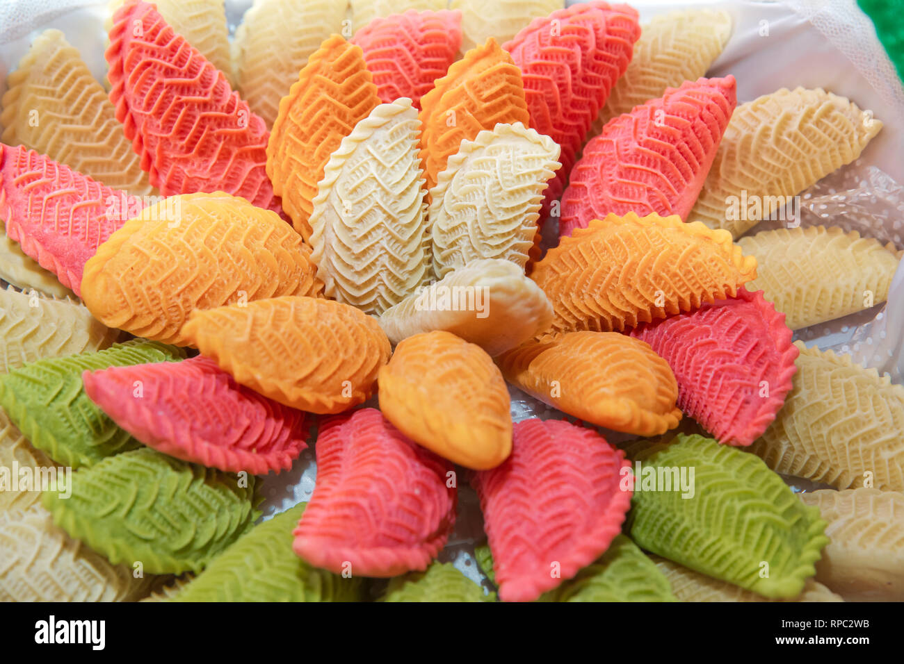 Colorfull Shekerbura with nuts and honey on wooden table background ...